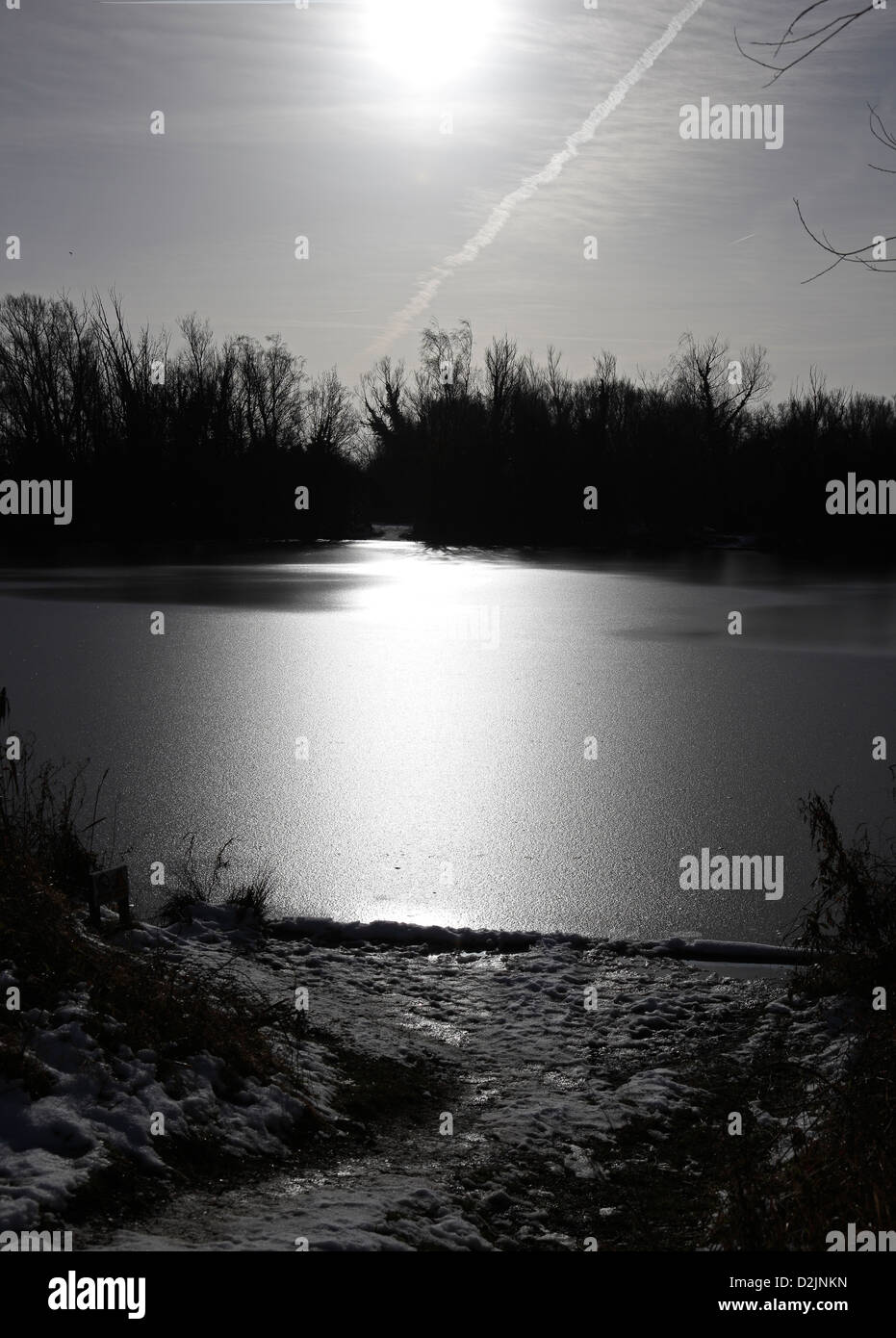 Winter lake scene contra-jour mono Milton Cambridgeshire Stock Photo ...