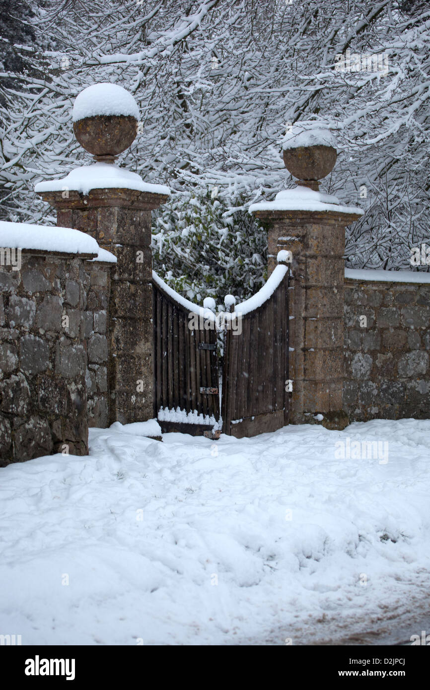 Country Mansion Walls and gate covered in snow Stock Photo - Alamy