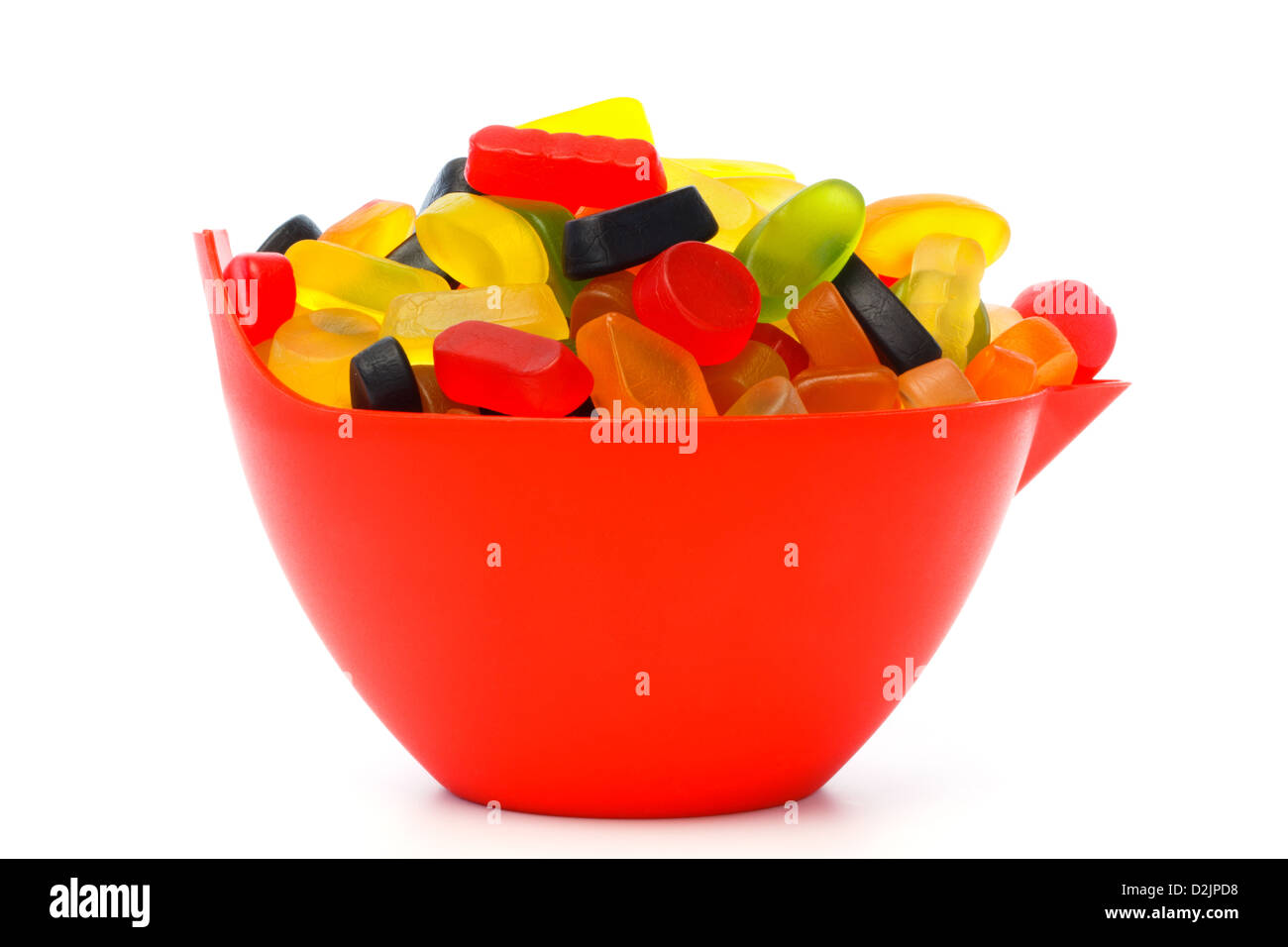 Bowl with colorful candy against white background Stock Photo - Alamy