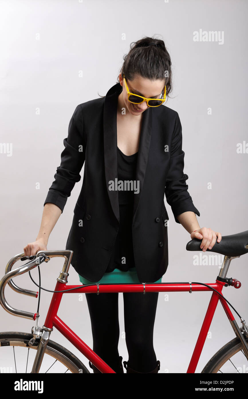 Hipster girl with red bike Stock Photo - Alamy