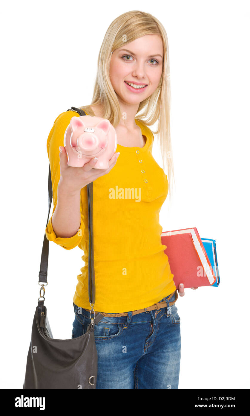 Happy student girl showing piggy bank Stock Photo - Alamy