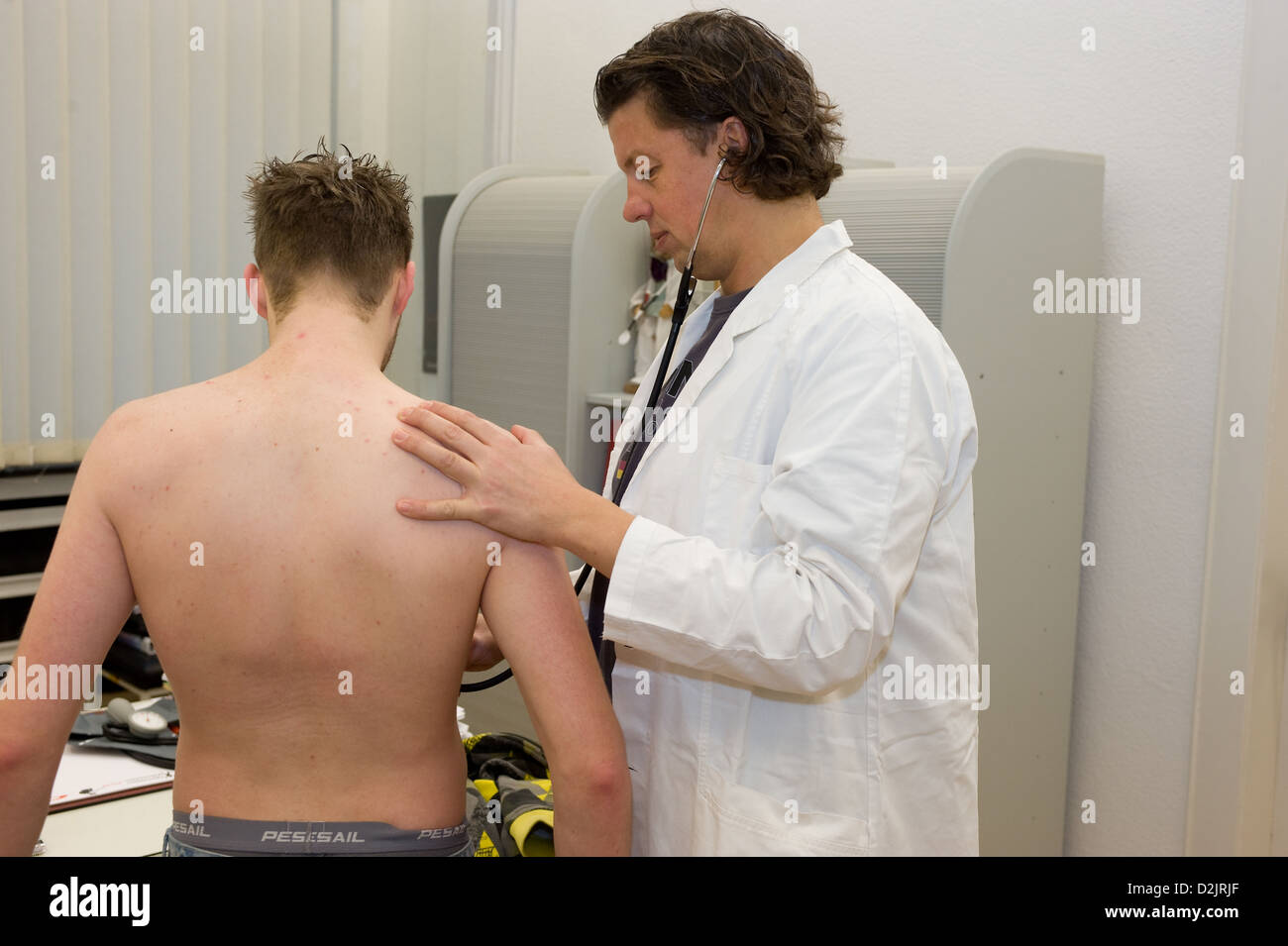 Duisburg, Germany, a doctor examines a patient in his practice Stock ...