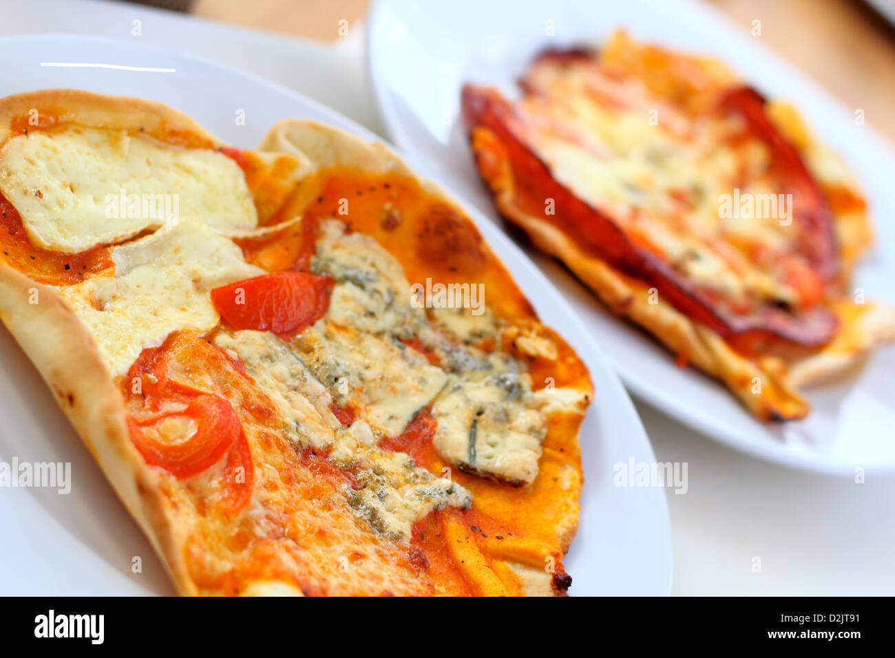 Some pizza on the plates Stock Photo - Alamy