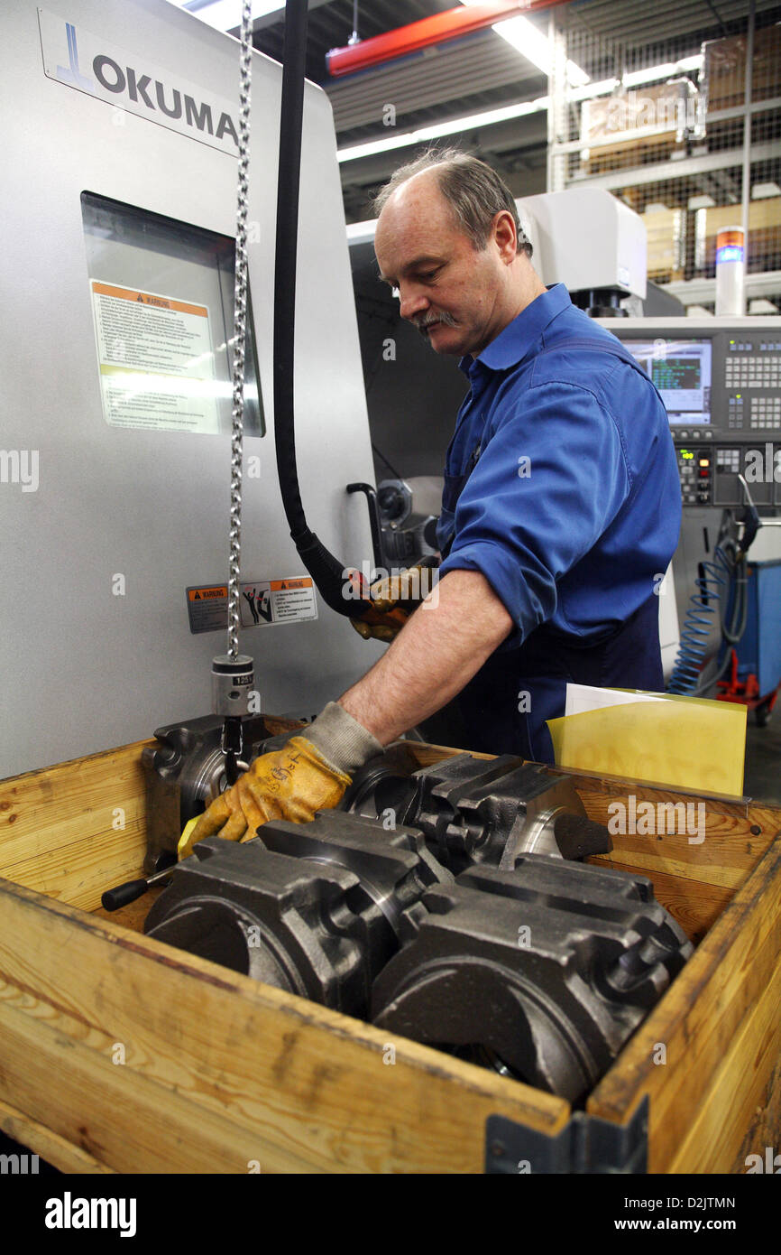 Man operating a crane at the HAWE Hydraulik GmbH, Berlin, Germany Stock ...