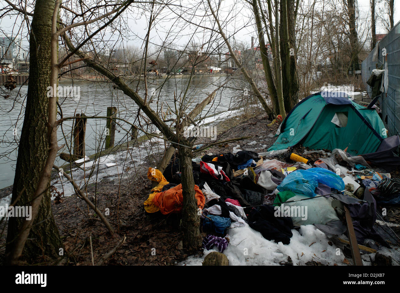 Berlin, Germany, a homeless tent and scattered laundry on the river ...