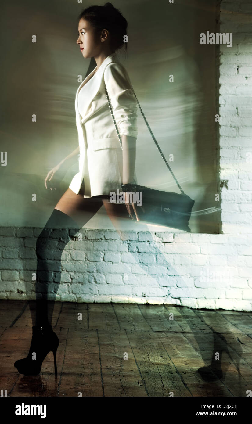 Young slim japanese woman fashion. Motion effect Stock Photo - Alamy