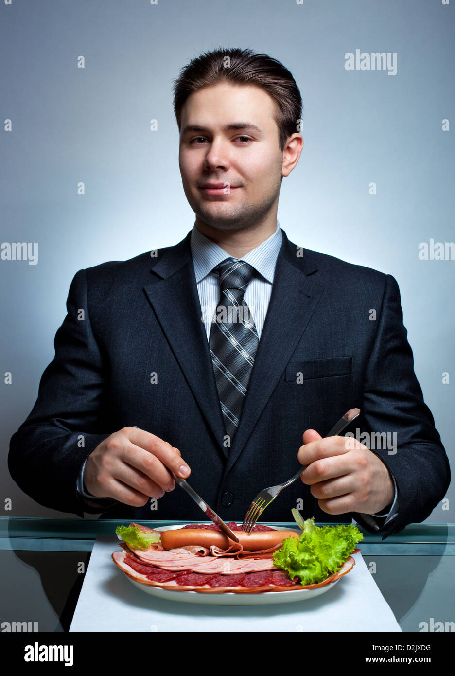Businessman eating meat hi-res stock photography and images - Alamy