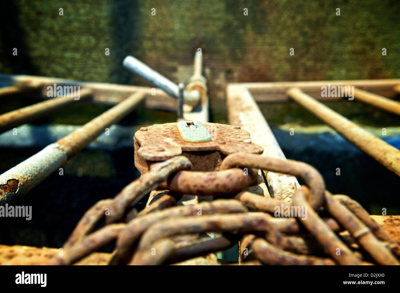 Looking down and over rusty old metal gate Stock Photo - Alamy