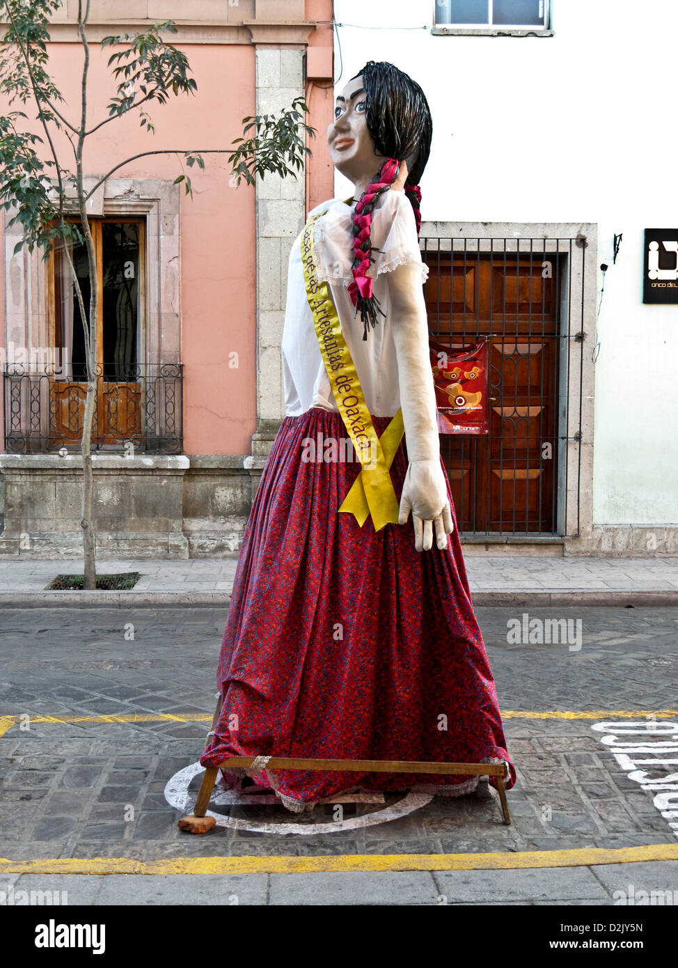 traditional folk art los gigantes figure with pink ribbons in her ...