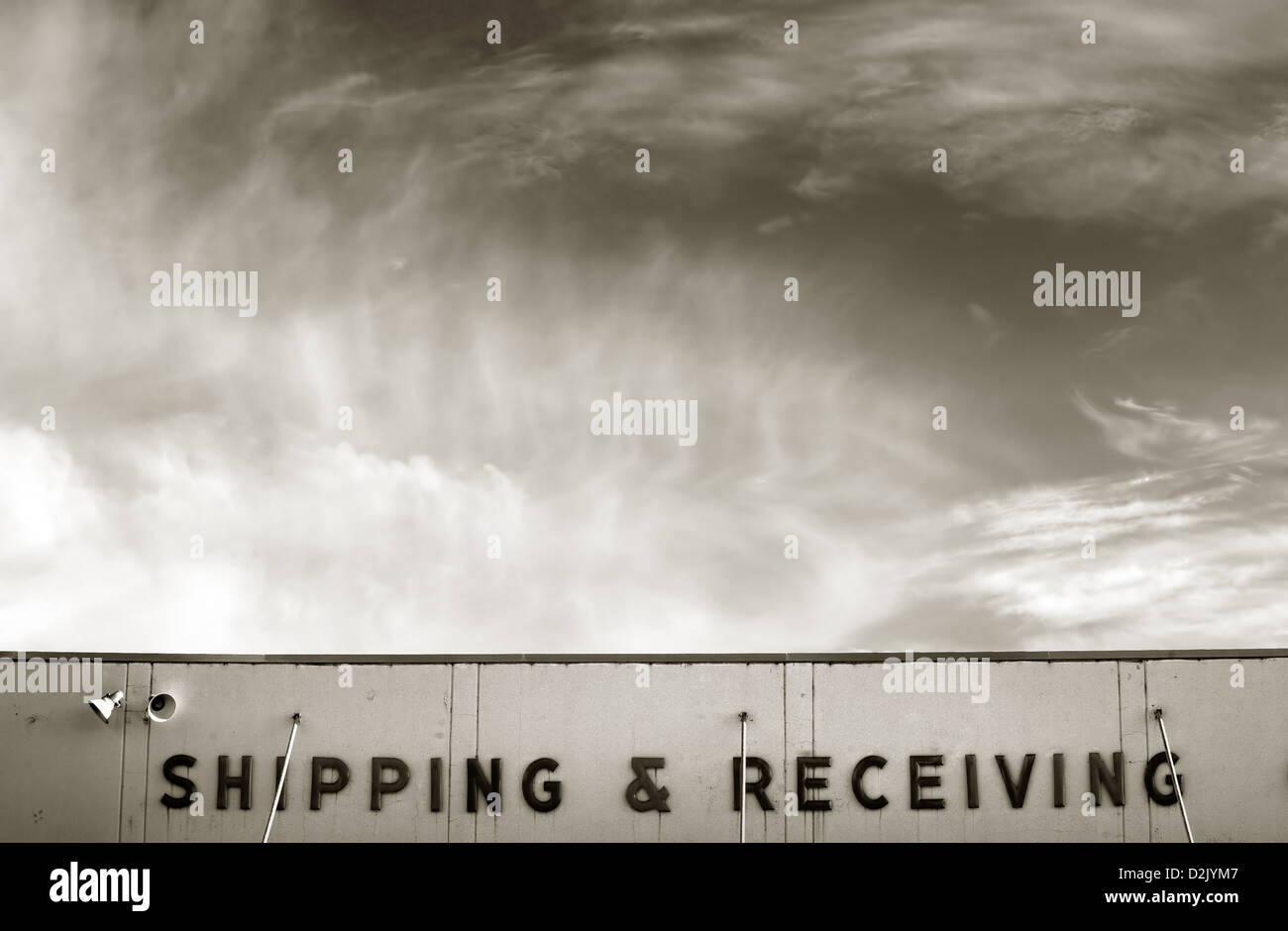 Photo of a sign for "Shipping and Receiving" under a brilliant blue sky ...