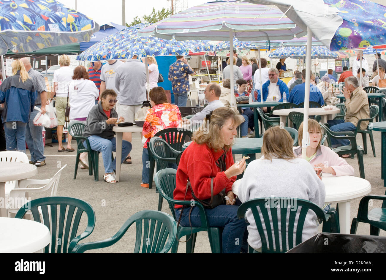 Photo of a crowd enjoying themselves at the food court of Astoria ...
