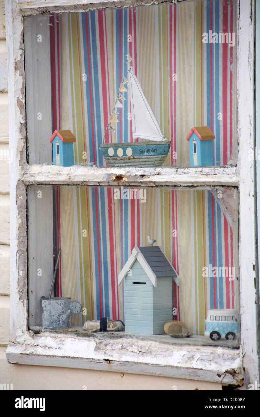 Collection of curios in beach hut window at Hengistbury Head, Dorset in ...