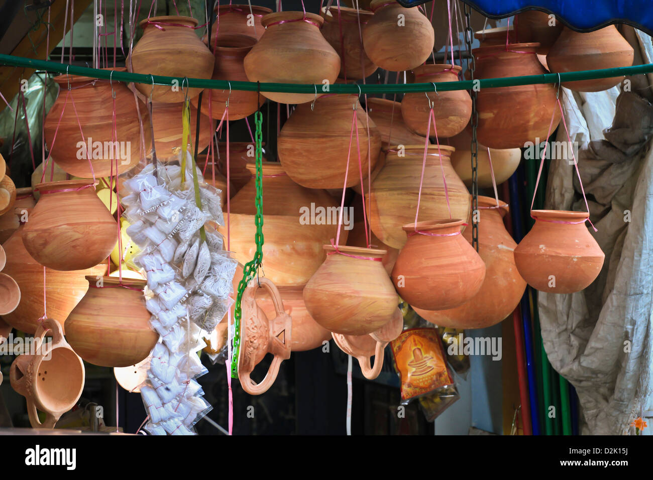 Hanging large number of clay pots on the market Stock Photo - Alamy
