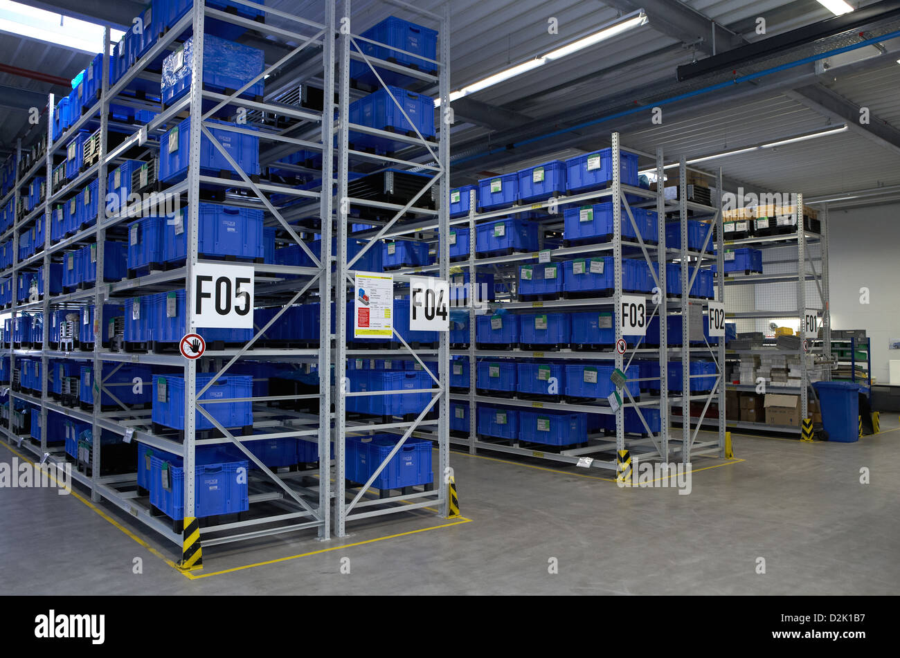 Berlin, Germany, rack storage with blue plastic crates Stock Photo - Alamy