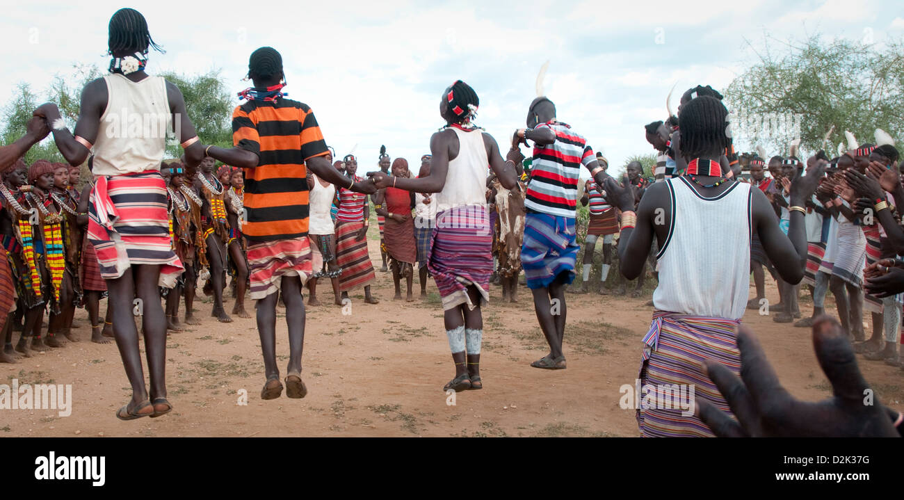 Hamar men and women in semi-circle during ceremony, with men jumping ...