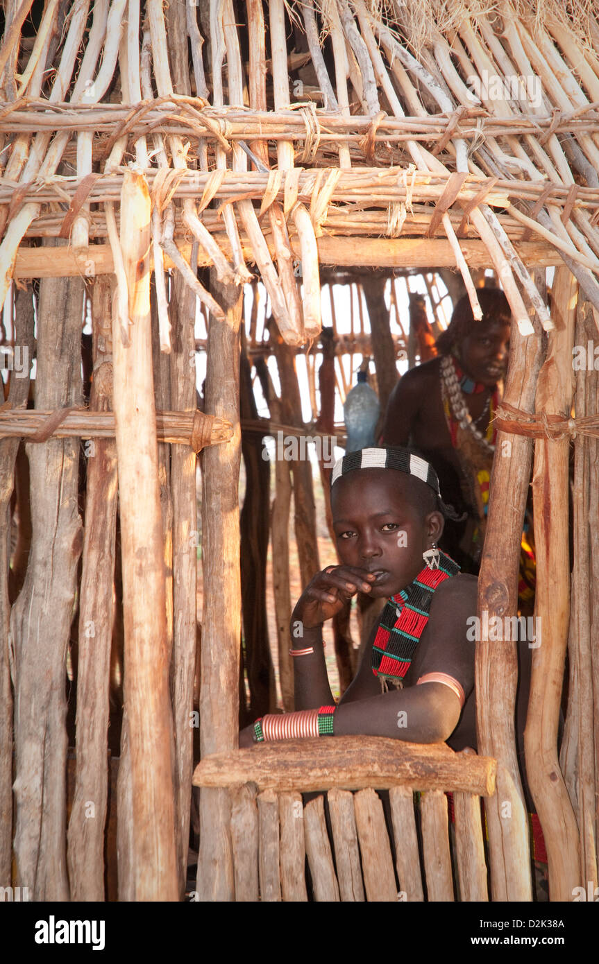 Hamar Woman looking out window of hut Stock Photo - Alamy