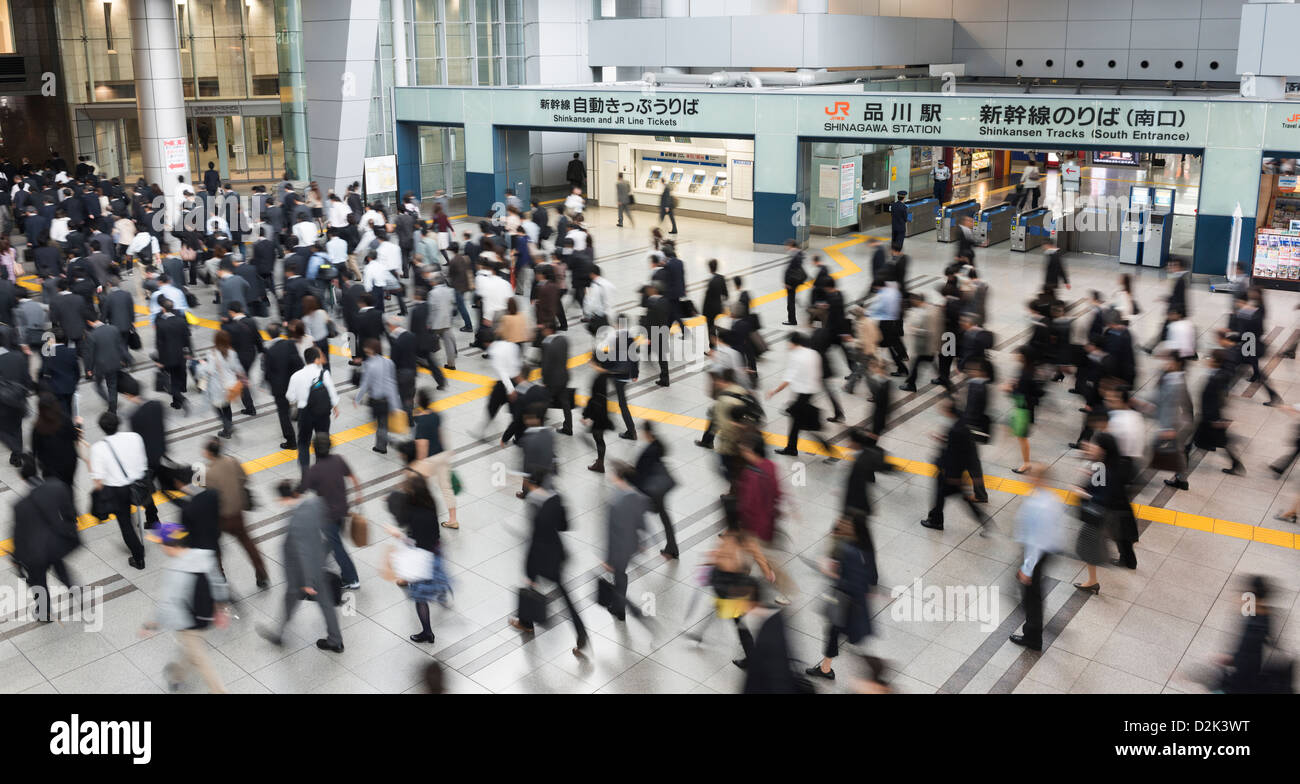 Workers commuting to work at the busy Shinagawa Station in Tokyo Japan ...