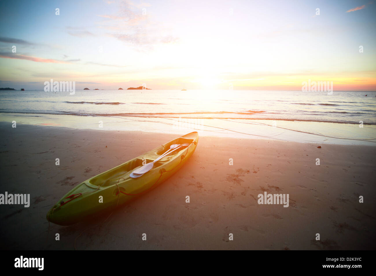 Kayak at the tropical beach at sunset Stock Photo - Alamy