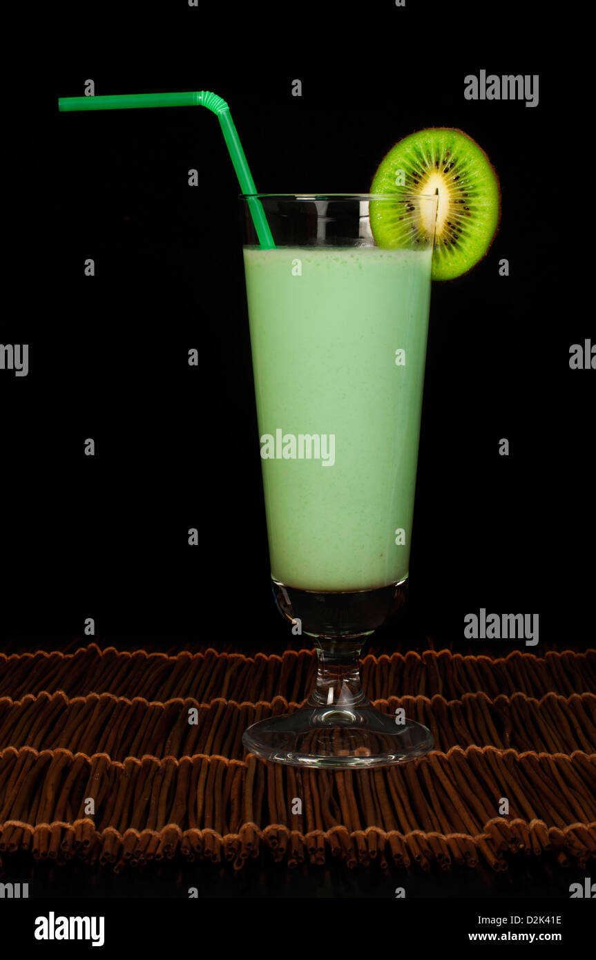 Kiwi milk shake and fresh fruit kiwi. Cocktail with milk. White ...