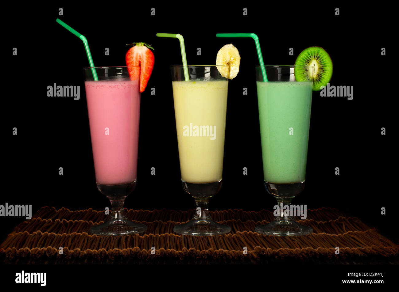 Banana, kiwi and strawberry milk shake and fresh fruis. Cocktail with ...