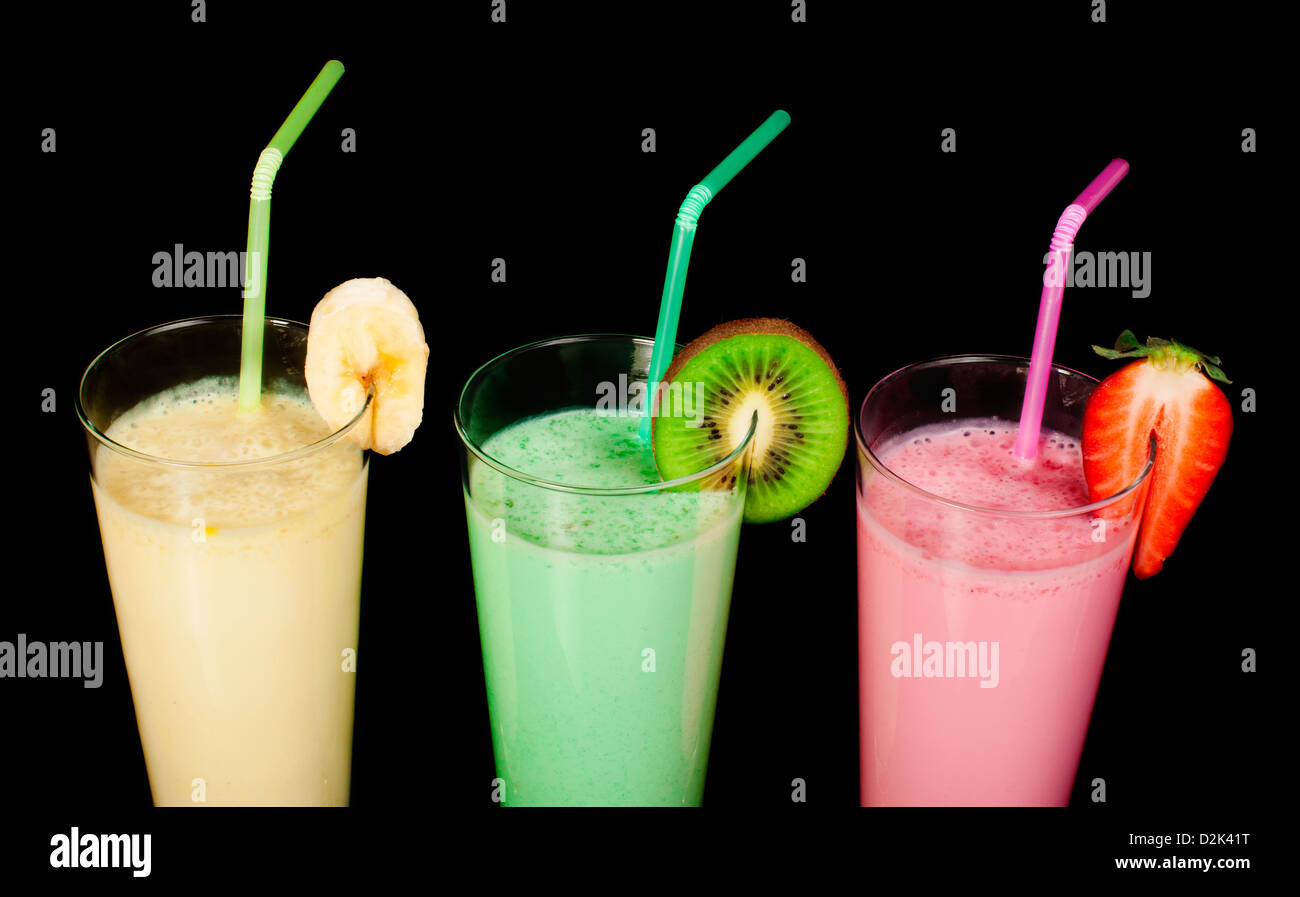 Banana, kiwi and strawberry milk shake and fresh fruis. Cocktail with ...
