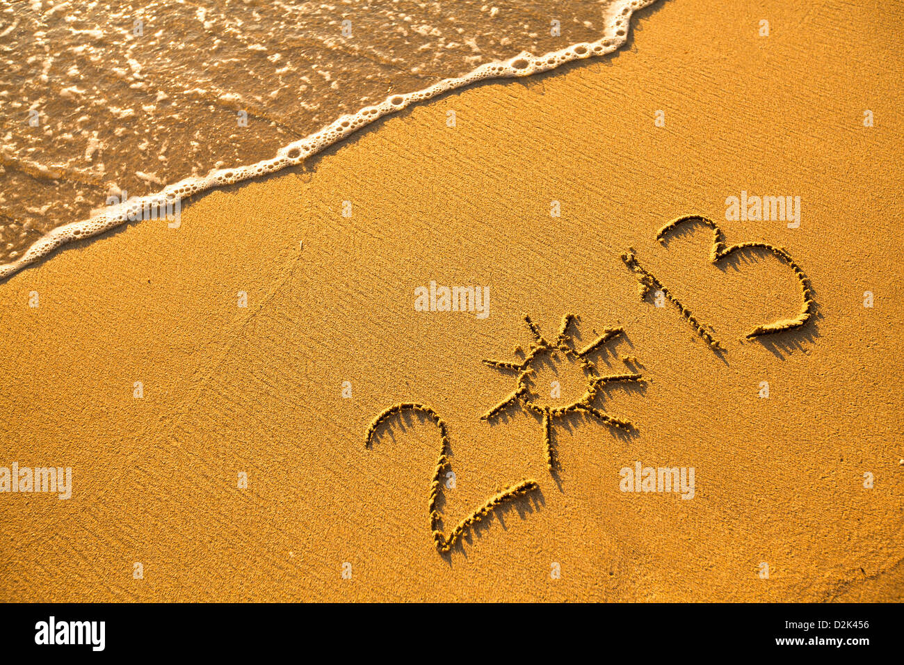 Abstract picture: 2013 written in sand on beach texture (soft wave of ...