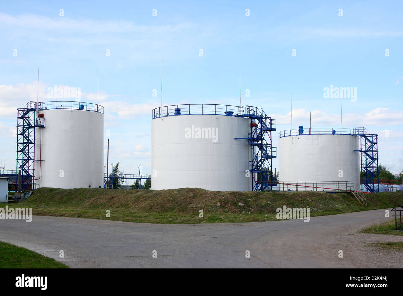 Oil tanks against the blue sky Stock Photo - Alamy