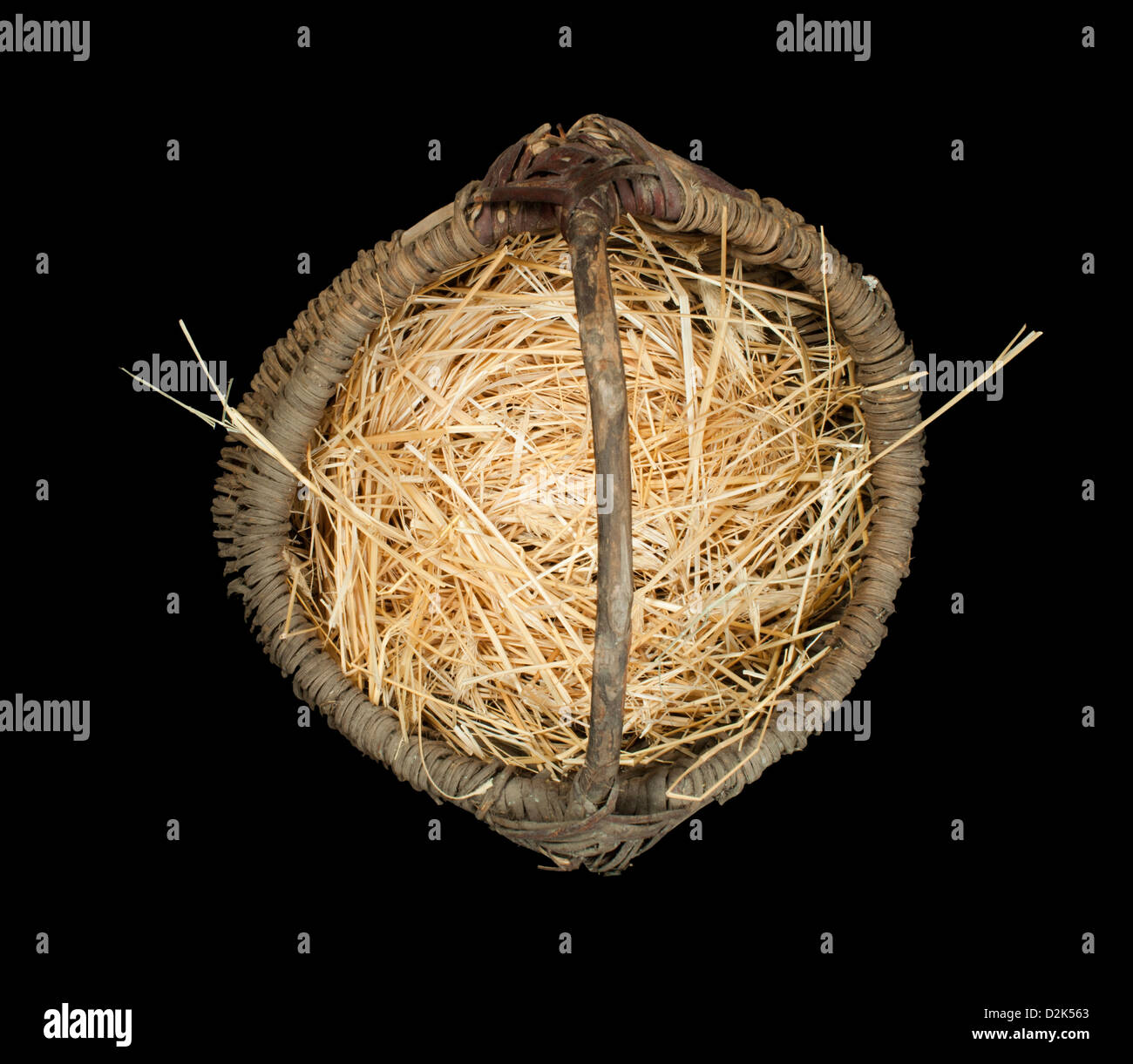 Old wicker basket with straw inside. Black isolated Stock Photo - Alamy