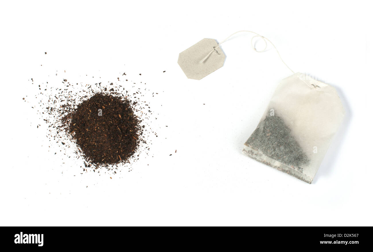 Tea bag with white label and pile of tea. Close up white isolated Stock ...