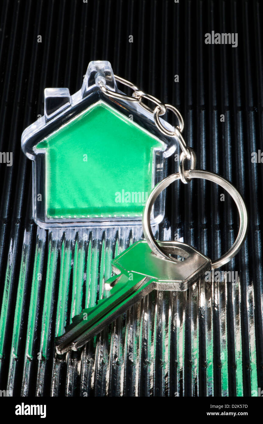 Keychain figure of house and key close up Stock Photo - Alamy