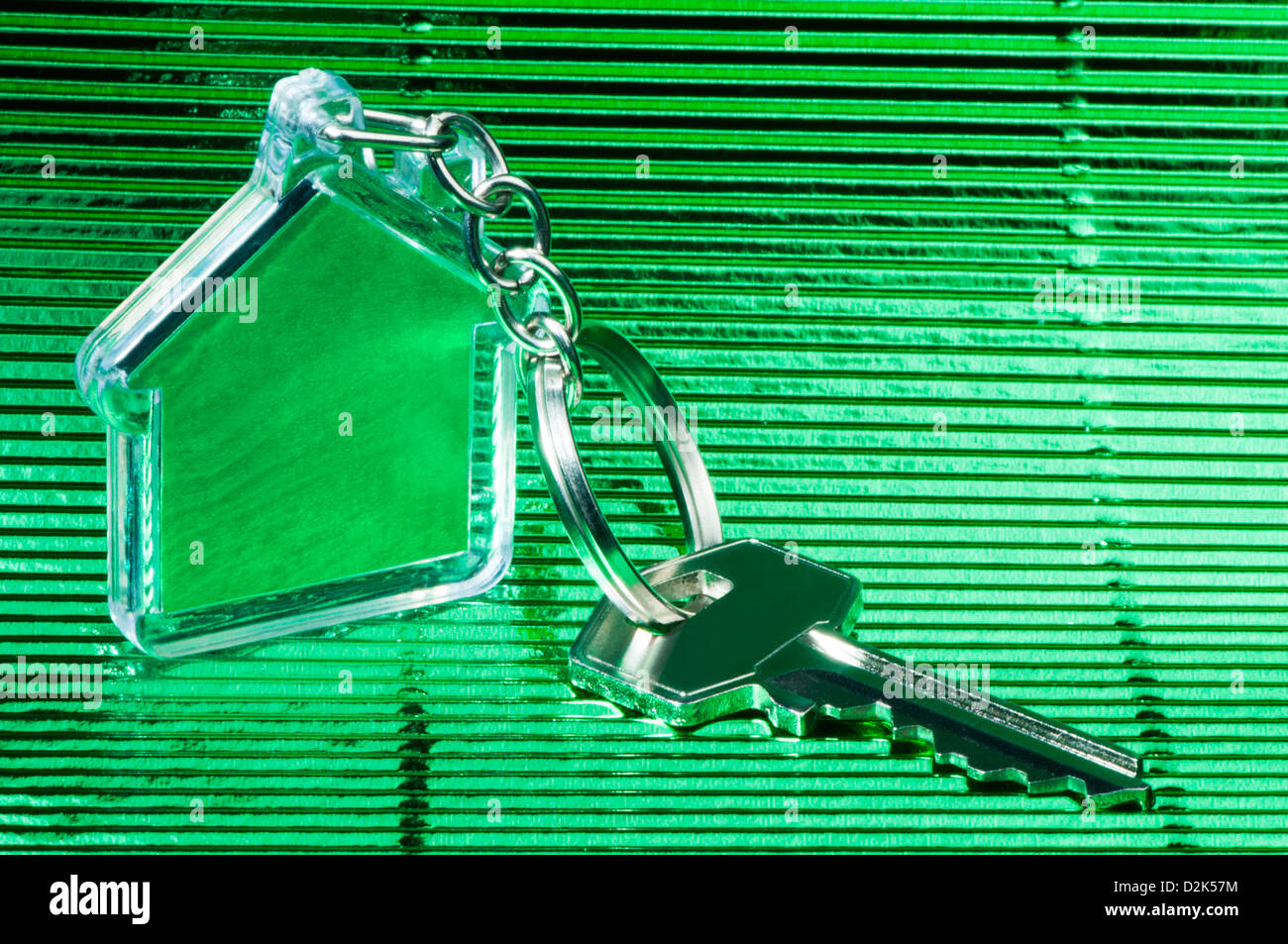 Keychain figure of house and key close up Stock Photo - Alamy