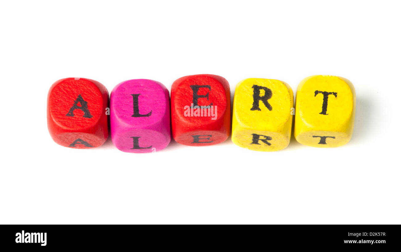 Word alert. White isolated wooden multicolored cubes Stock Photo - Alamy