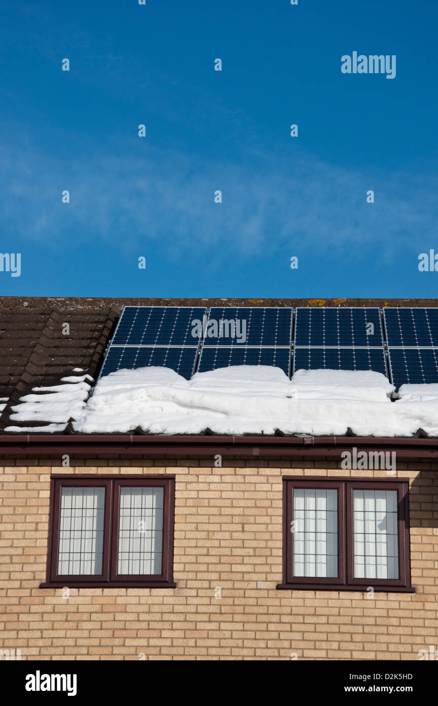 Domestic solar photovoltaic panels on roof of house with snow Stock ...
