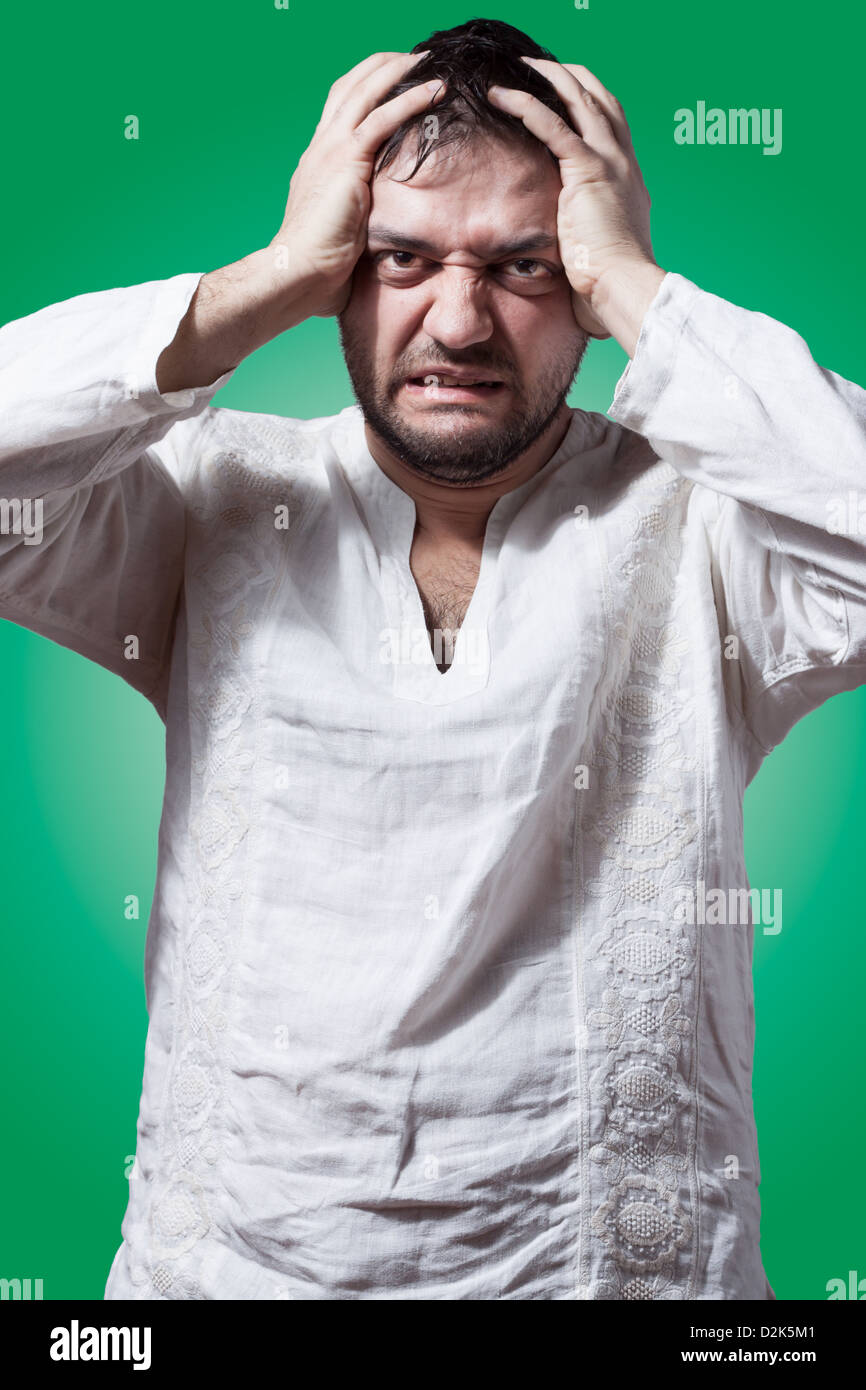 Funny bearded man with desperate expression on green background Stock ...