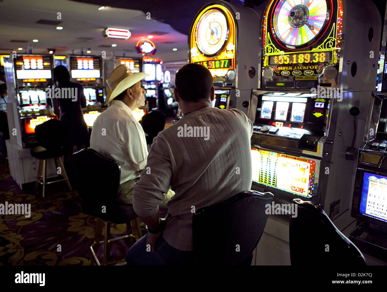 Playing the fruit machines hi-res stock photography and images - Alamy