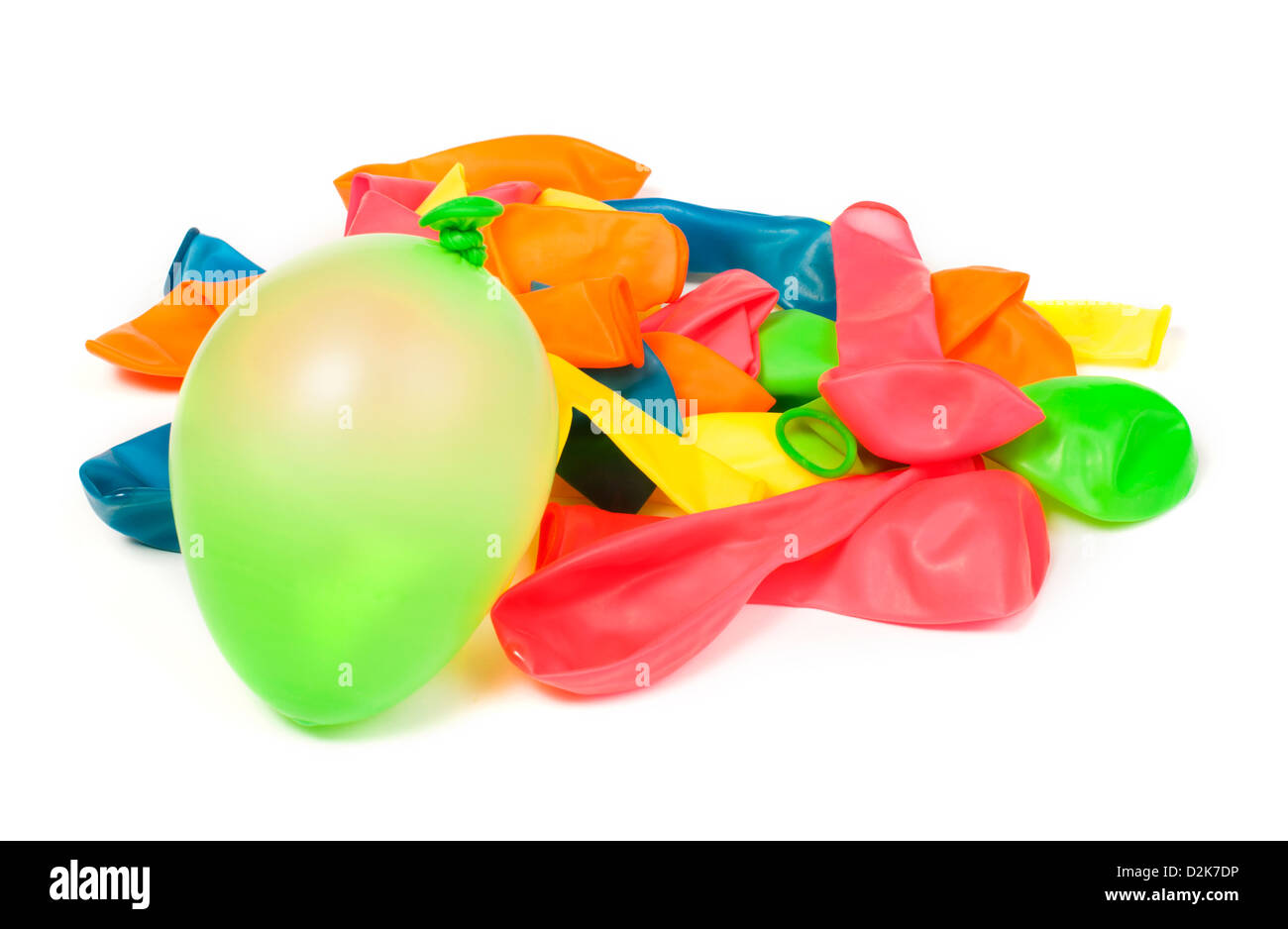 Pile of uninflated balloons from different colors. White isolated Stock ...