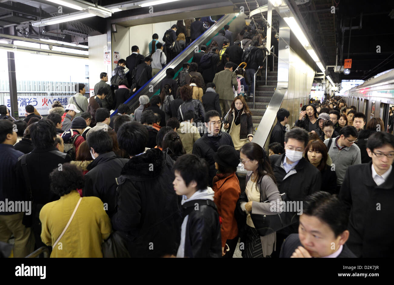 Tokyo, Japan, people on a regional train platform of Shinjuku Station ...