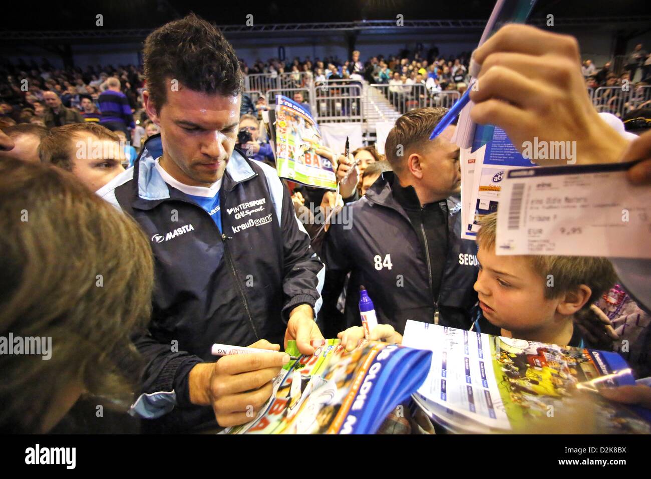 Former German national team player, Michael Ballack (C), signs an ...