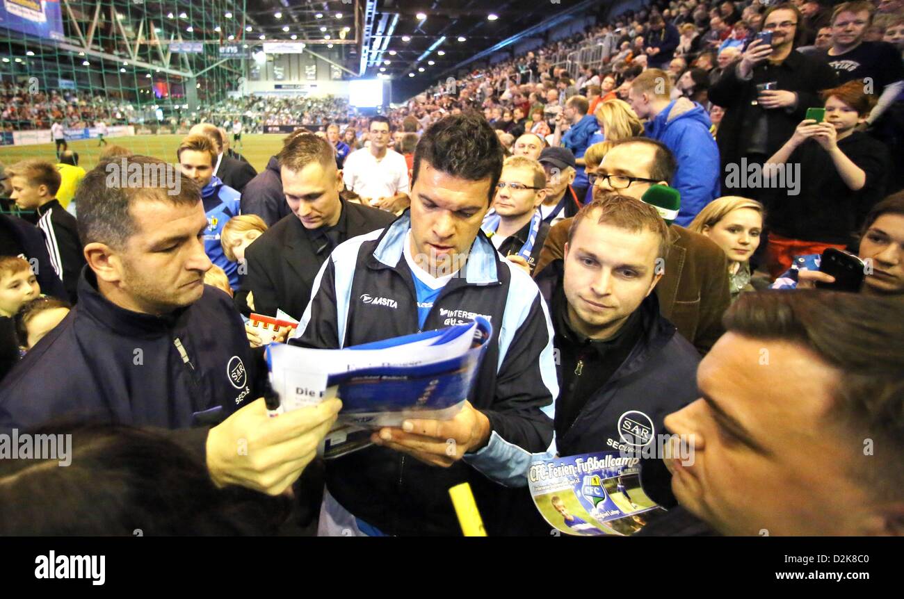 Former German national team player, Michael Ballack (C), signs an ...