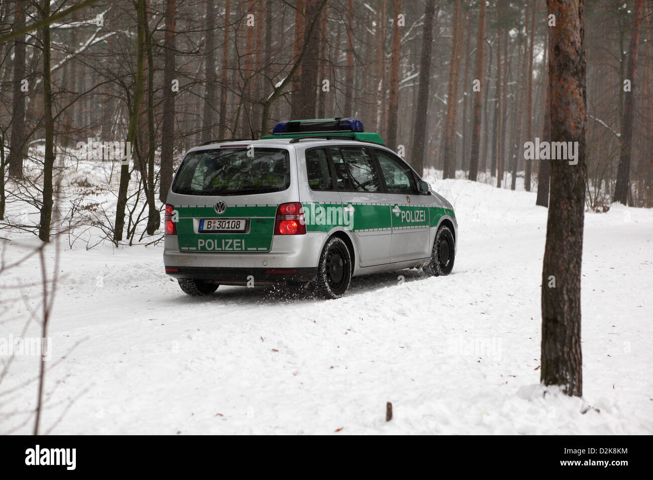 Berlin, Germany, police car drive through the snowy Grunewald Stock ...