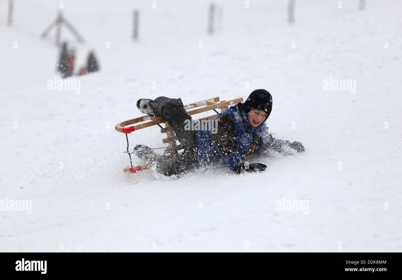 Berlin, Germany, the boy fell from his sled while sledding Stock Photo ...