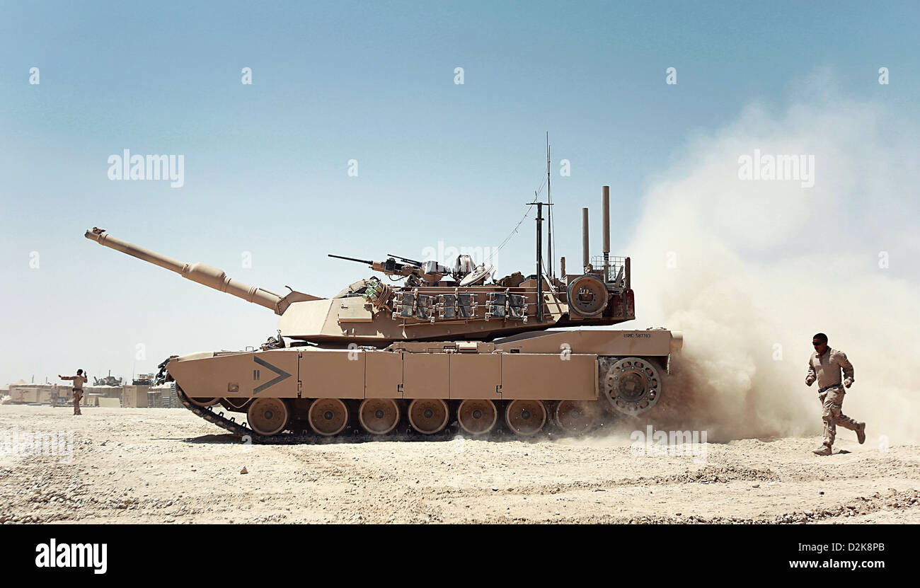A US Marine Corps M1A1 Abrams tank finishes refueling at Combat Outpost ...