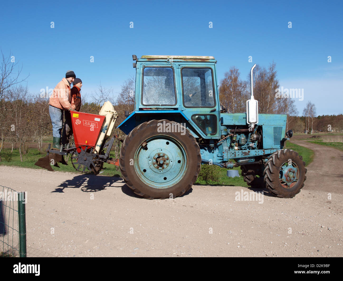 Going to plant potatoes with russian tractor powered two furrows ...