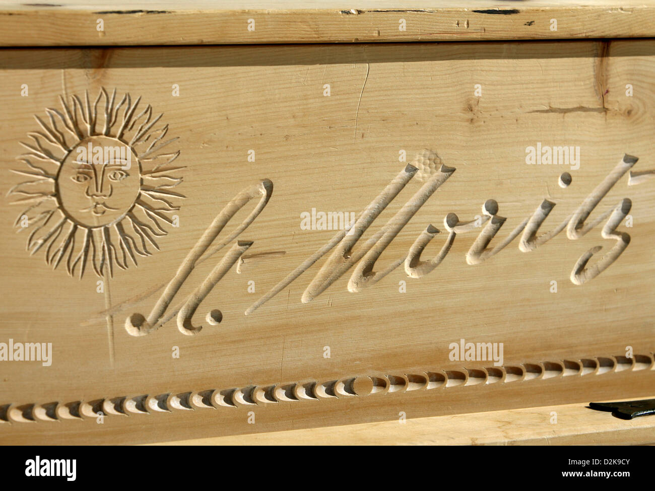 St. Moritz, Switzerland, St. Moritz and a sun logo carved in wood Stock ...