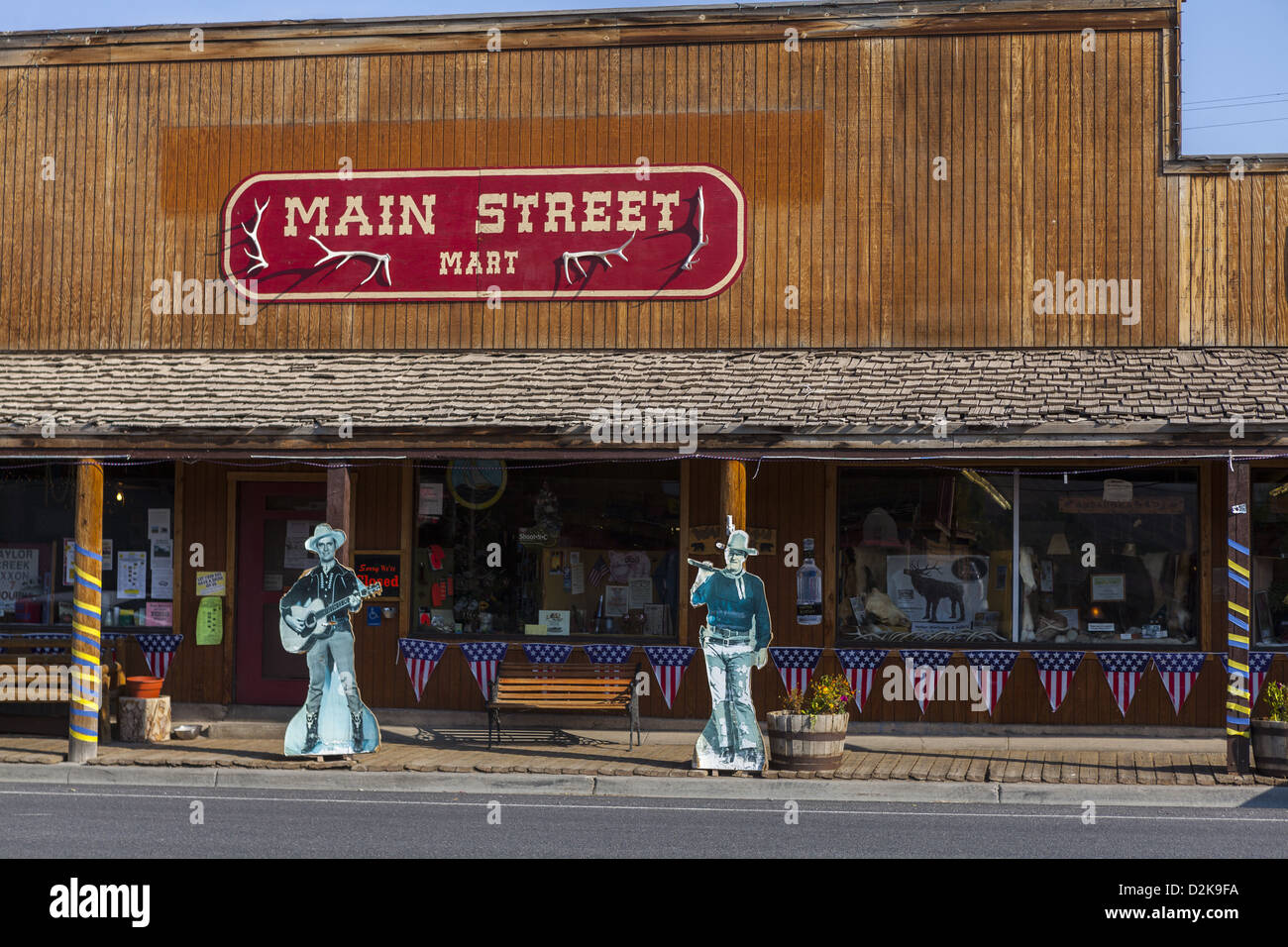 Old western main street shop with wooden front and cowboy cut outs in ...