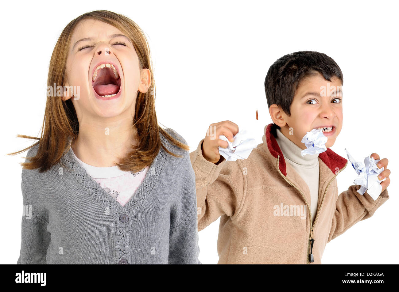 Young girl screaming and boy chewing paper isolated in white Stock ...