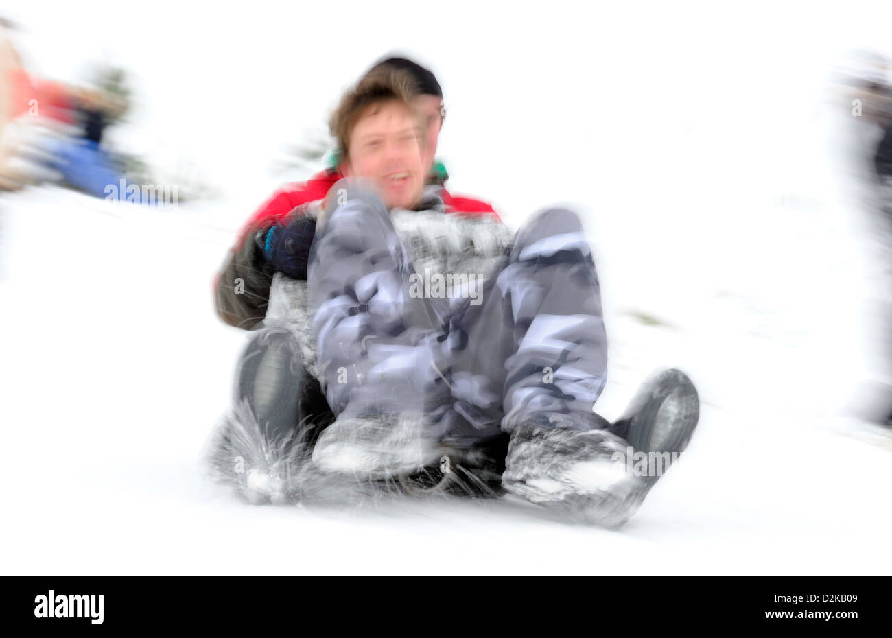 Slide down a snowy hill hi-res stock photography and images - Alamy
