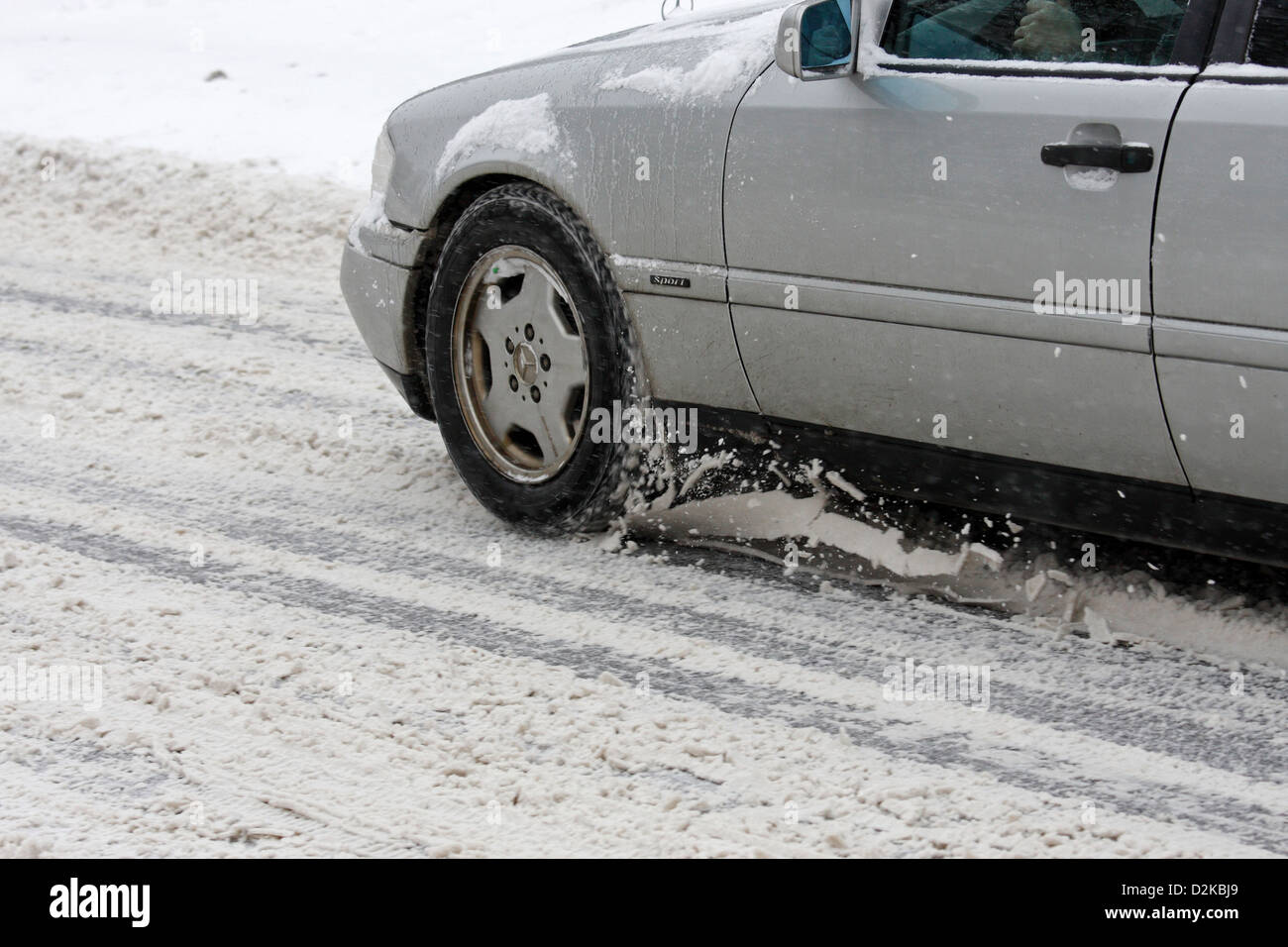Leipzig, Germany, car swirls of slush on the road Stock Photo - Alamy