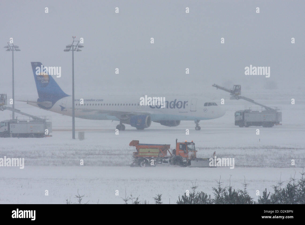 Leipzig, Germany, de-icing an Airbus A320 Condor and a snow removing ...