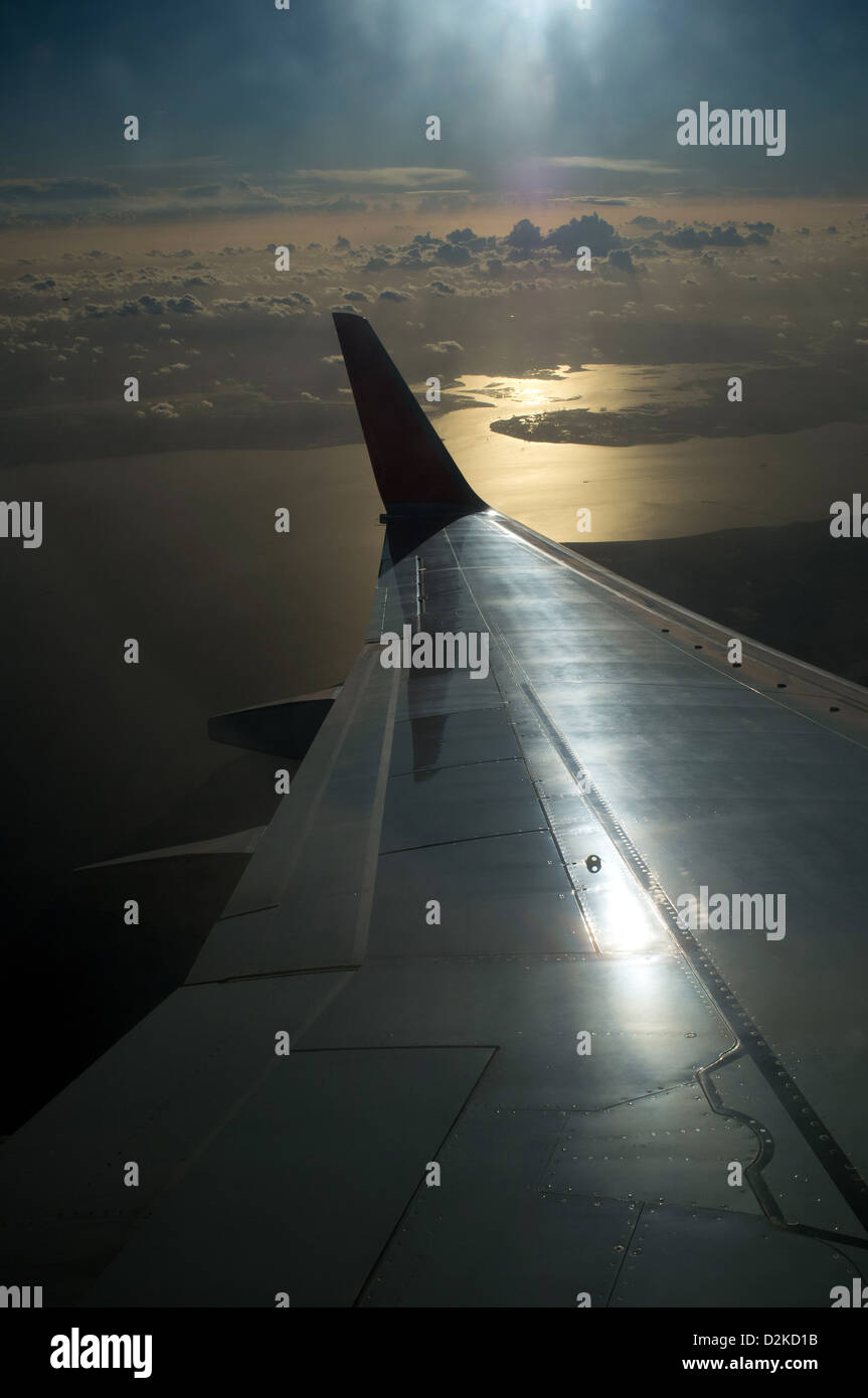 Flight wing in the air through the flight window Stock Photo - Alamy